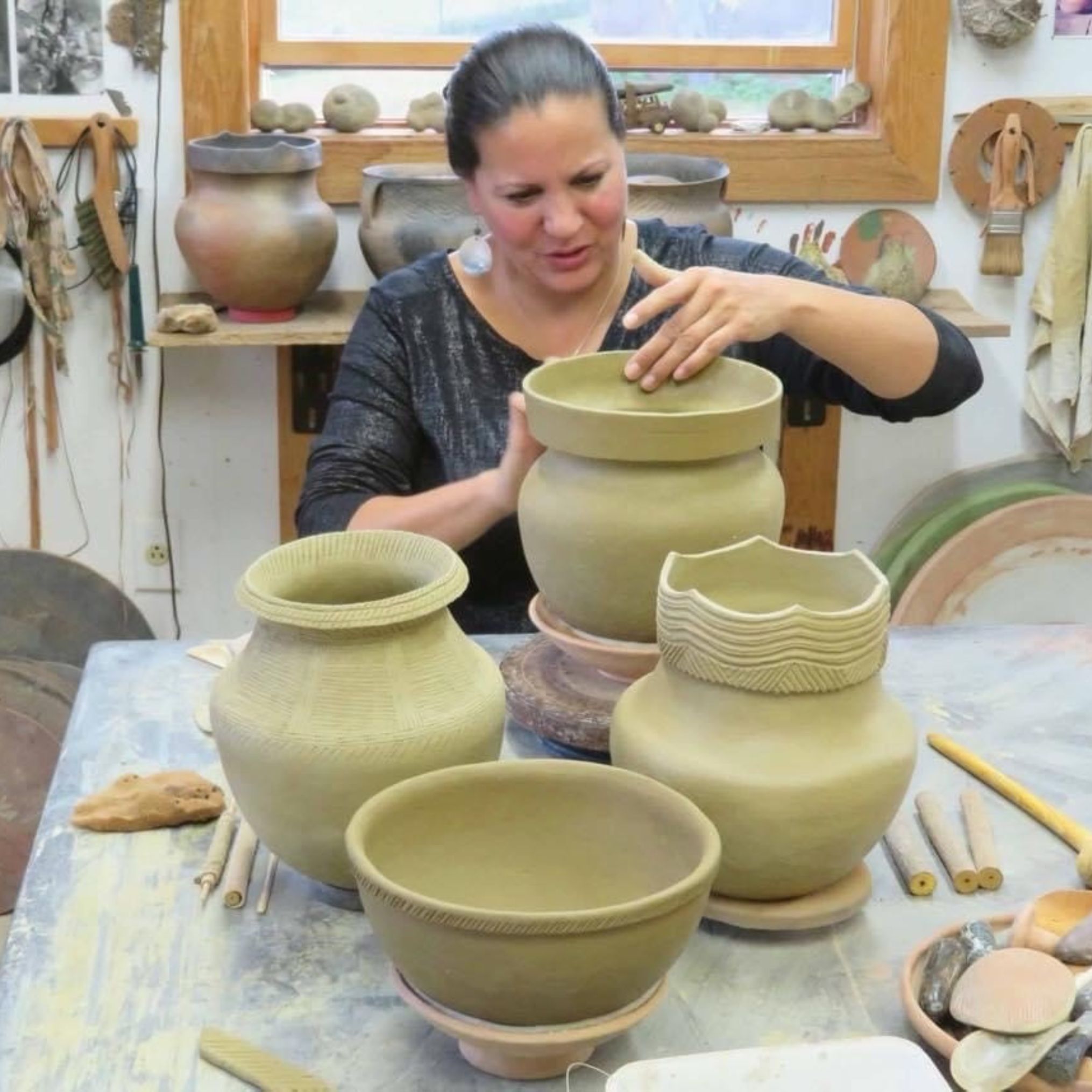 Jennifer M Stevens creating Oneida pottery with traditional methods